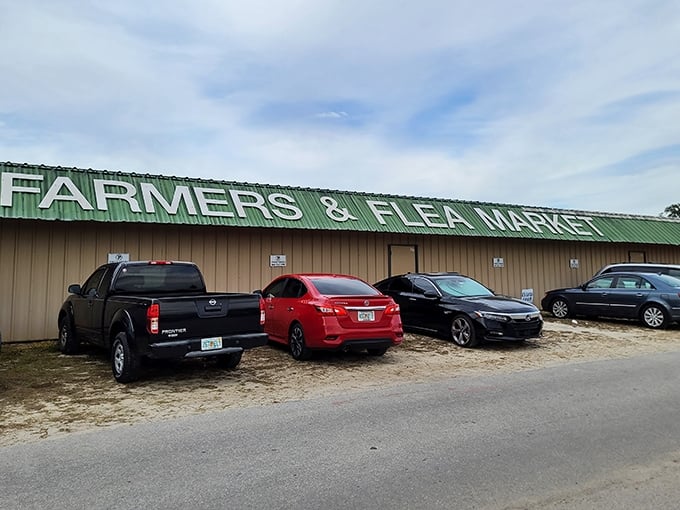 The Farmers & Flea Market sign welcomes bargain hunters and collectors alike – your first clue that wallet-emptying temptation lies just beyond those doors.