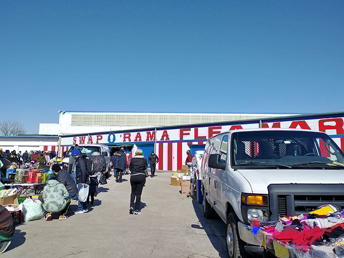 The red and white striped exterior of Swap-O-Rama beckons like a circus of commerce under clear Illinois skies. Treasure hunting begins here!