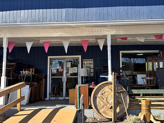The unassuming entrance to treasure-hunting paradise. Pink and white bunting flutters above, promising delightful discoveries within these blue walls.