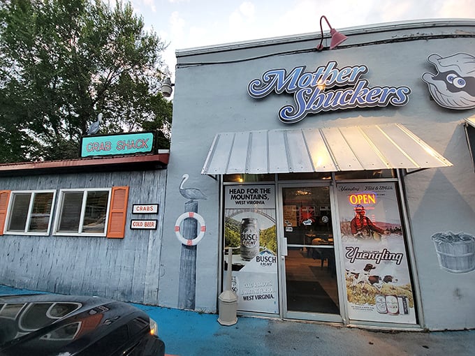 The unmistakable blue exterior of Mother Shuckers, where that giant crab on the roof isn't just decoration—it's a promise of what awaits inside.