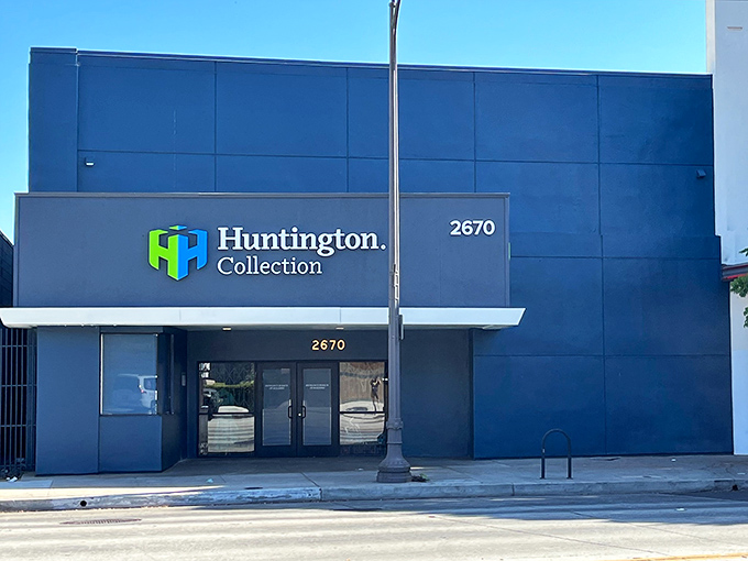 The sleek blue exterior of Huntington Collection belies the treasure trove within—like finding a portal to vintage paradise disguised as a modern building.