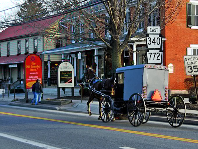 Where horse-drawn buggies and brick homes coexist in perfect harmony – a quintessential scene from Intercourse, Pennsylvania that feels like stepping into another era.