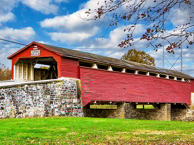 The classic barn-red exterior of Wehr Bridge stands in perfect contrast to Pennsylvania's lush greenery, like a Norman Rockwell painting come to life.