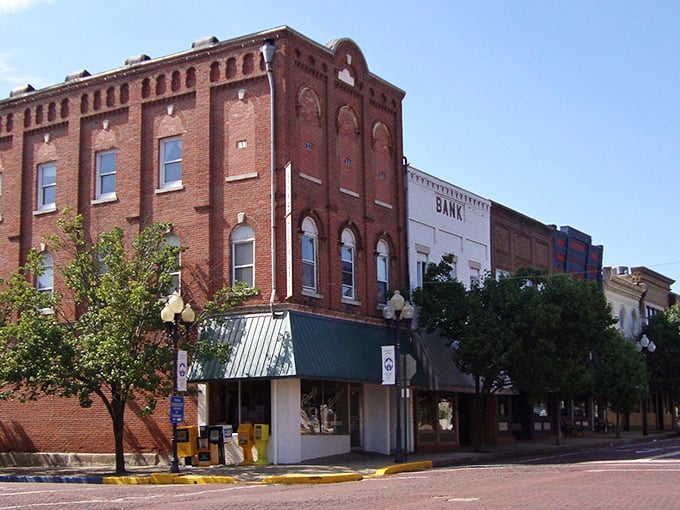 Historic brick buildings stand sentinel on Fulton's Court Street, where time seems to slow down just enough to notice architectural details modern buildings forgot.