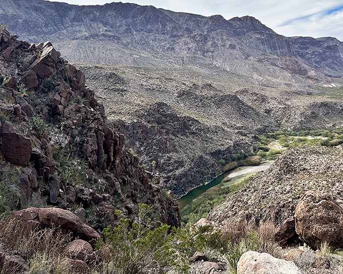 Where the Rio Grande carves its signature through ancient rock, creating a ribbon of life amid the rugged terrain that would make Georgia O'Keeffe reach for her paintbrush.