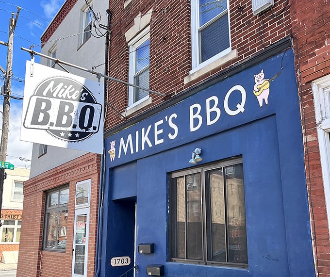 A closer look at Mike's BBQ's vibrant blue exterior and playful pig logo – a siren call to barbecue enthusiasts throughout South Philadelphia.
