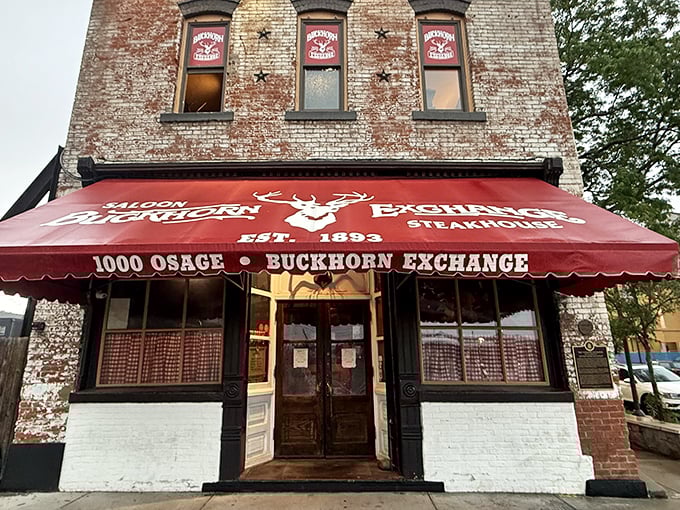 That iconic red awning isn't just for show—it's a beacon for meat lovers, announcing "serious steakhouse business happens here" since the days of Buffalo Bill.