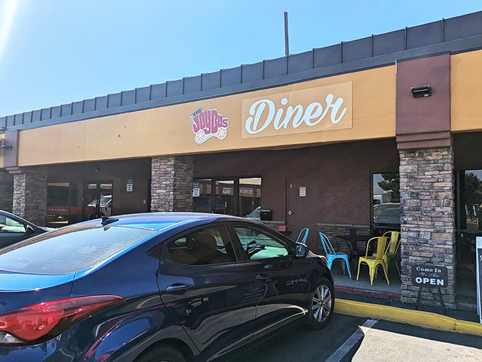 The sunny facade of The Joy Bus Diner welcomes hungry visitors with its cheerful signage and stone accents – a beacon of breakfast bliss in Phoenix.