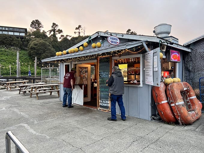 That cheerful little shack with the buoys and "OPEN" sign is your gateway to deep-fried cheesecake paradise.