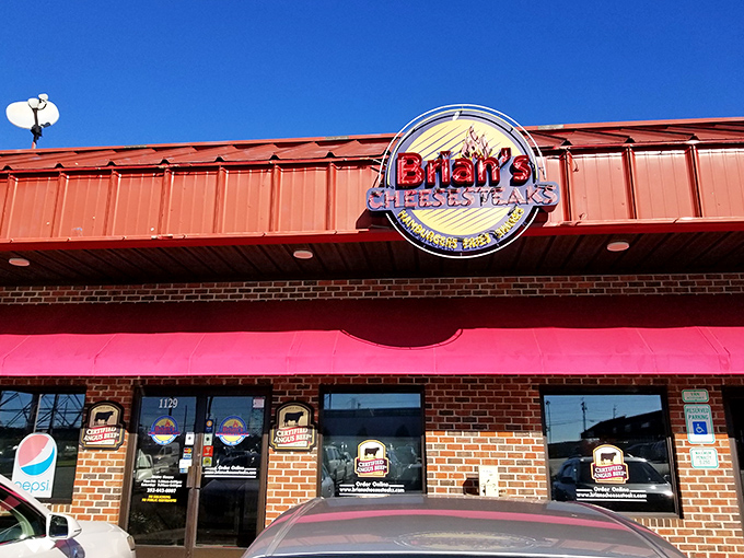 The brick facade and bright signage of Brian's Cheesesteaks stands as a beacon of hope for hungry travelers on Rocky Mount's horizon.
