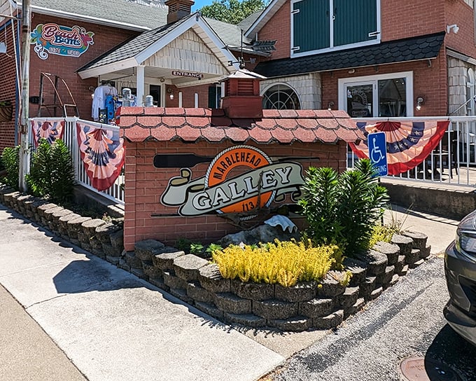 Marblehead Galley’s welcoming brick exterior, dressed in patriotic bunting, hints at the lakeside flavors and hometown pride that locals have cherished for years.