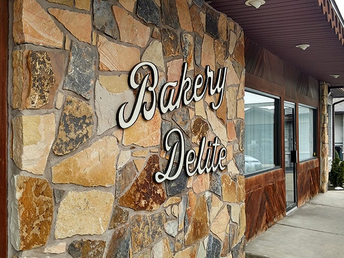 The stone facade of Bakery Delite stands like a delicious fortress of flavor, promising sweet treasures within its rustic walls.