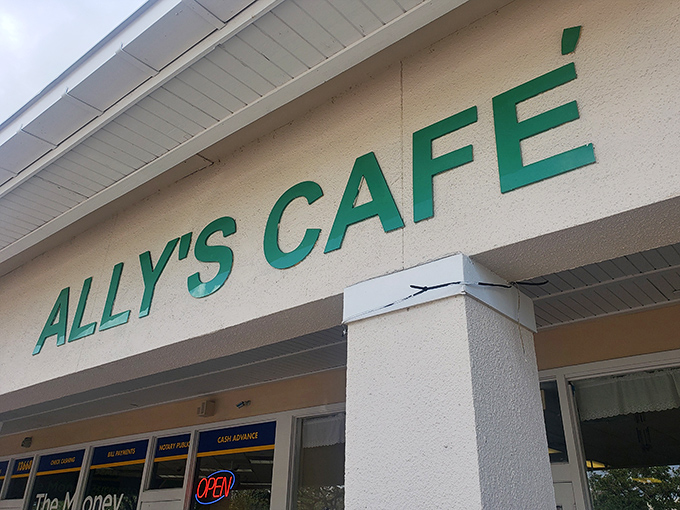 The green lettering against cream-colored stucco isn't trying to impress anyone—it's too busy promising honest-to-goodness comfort food inside.