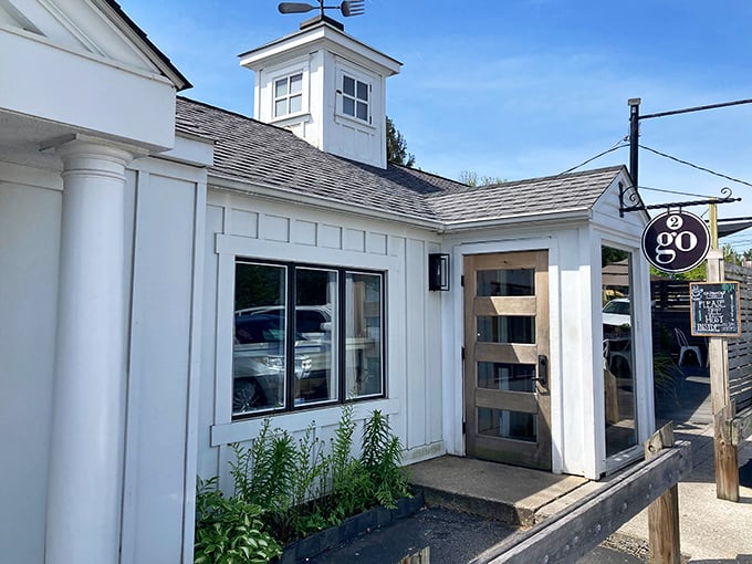 A charming farmhouse-inspired exterior with the distinctive "2go" sign beckoning hungry travelers. This isn't just a building—it's a breakfast beacon.