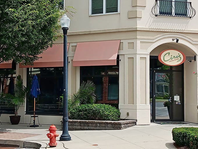 The welcoming facade of Ciro's Italian Bistro beckons with its distinctive coral awnings and lush greenery—like a little slice of Italy nestled in Lancaster.