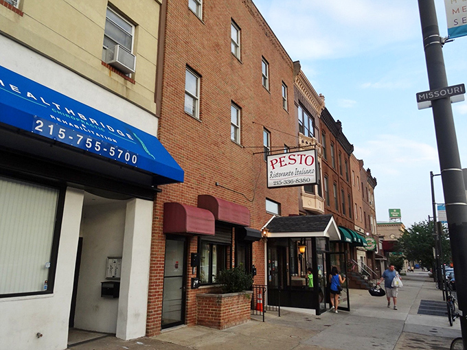 A glimpse of South Philly's Italian heritage, where Ristorante Pesto's maroon awning signals you've arrived at the neighborhood's pasta paradise.