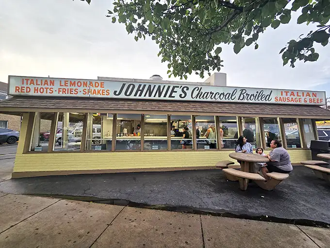 The humble temple of beef worship glows like a beacon in the night, promising salvation in sandwich form to all who make the pilgrimage.