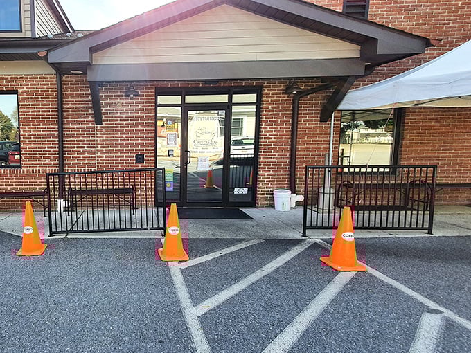 The unassuming entrance to barbecue paradise. Those orange cones aren't directing traffic—they're guiding hungry souls to smoked meat nirvana.