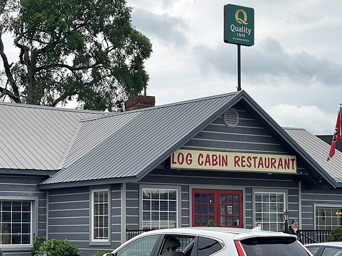 Those iconic red doors against the gray exterior aren't just welcoming – they're practically a beacon for hungry travelers seeking authentic Tennessee flavor.