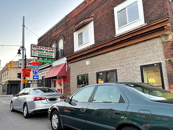 The unassuming brick exterior of Duly's Place stands like a time capsule on this Detroit corner, promising authentic flavors without the frills.