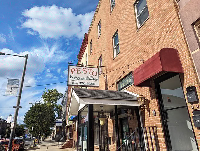 The unassuming brick exterior of Ristorante Pesto hides culinary treasures within, like a delicious Italian secret waiting to be discovered.