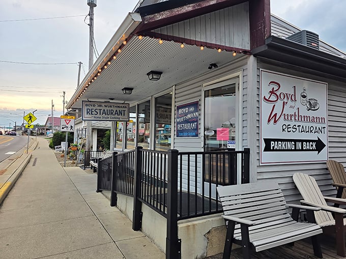 The white clapboard exterior with its green awning isn't trying to impress anyone—and that's precisely why it does. Classic Americana at its finest.