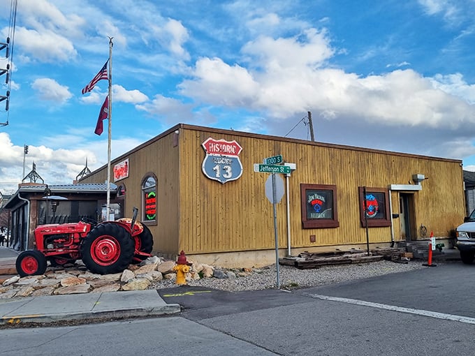 The unassuming wooden exterior of Lucky 13 stands like a burger speakeasy, complete with vintage tractor sentinel. Who knew paradise had a zip code?