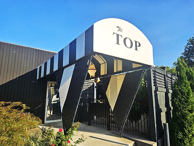 Where retro meets remarkable – The Top's distinctive exterior design makes a bold architectural statement before you even taste the food.