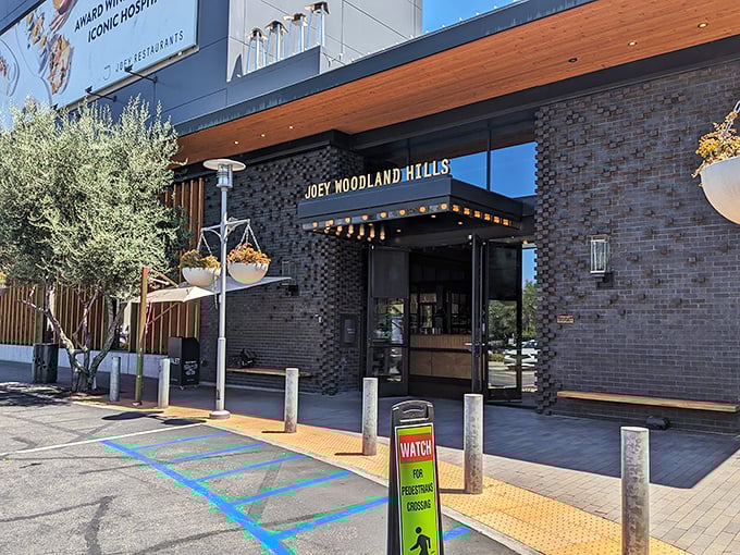 The sleek brick exterior of JOEY Woodland Hills promises sophistication without pretension—like your coolest friend who somehow always knows the best spots.