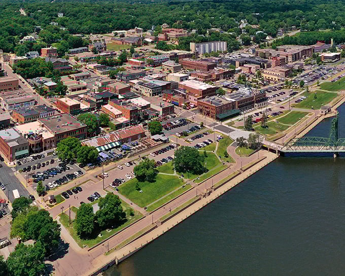 Stillwater's downtown riverfront unfolds like a miniature San Francisco without the hills—brick buildings, green spaces, and that magnificent lift bridge creating postcard perfection.