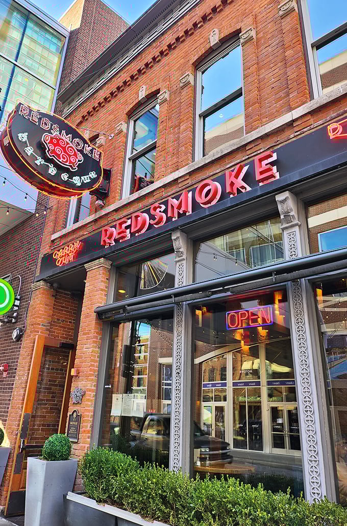 The iconic red signage of Redsmoke Barbeque glows like a beacon of meaty promise against the historic brick façade in Detroit's Greektown district.