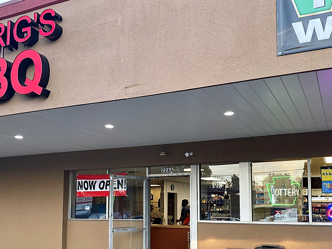 The unassuming tan façade with bold red lettering says everything you need to know: this place prioritizes smoke over style. Culinary treasures often hide in plain sight.