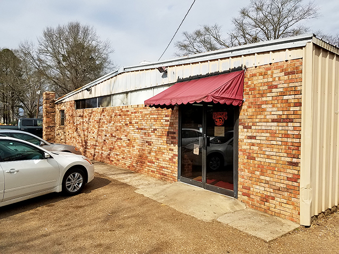That red awning is your beacon to barbecue bliss, guiding hungry travelers like a smoky North Star.