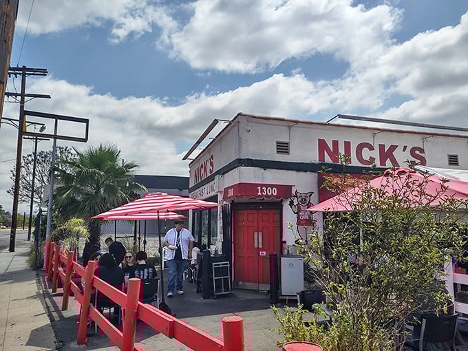The iconic red fence and striped umbrellas welcome hungry patrons like old friends to this beloved breakfast institution.