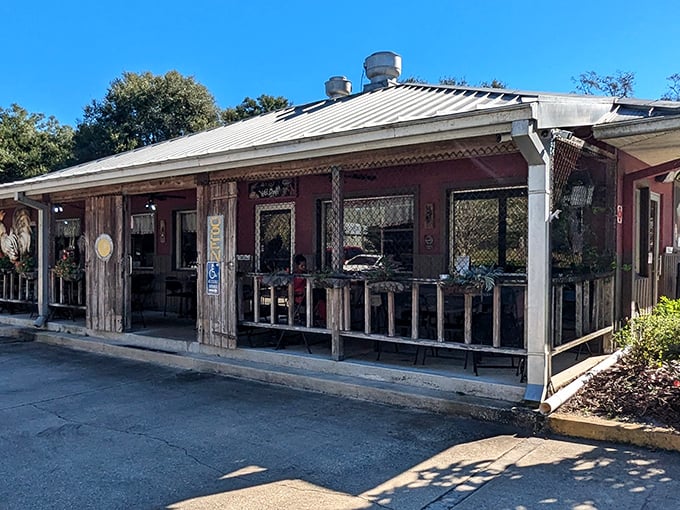 The weathered wooden exterior of Osteen Diner stands as a time capsule of Old Florida charm, promising authentic flavors inside those rustic walls.