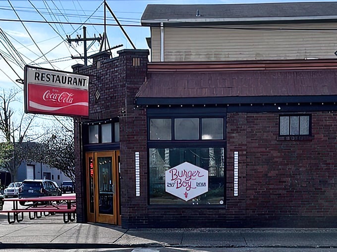 That classic Coca-Cola sign isn't just nostalgia – it's a promise of burgers done the old-fashioned way.