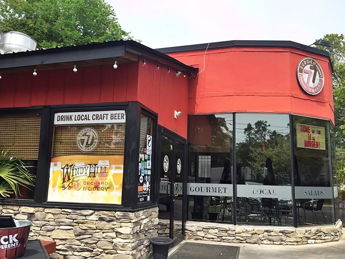The vibrant red exterior of Burger Tavern 77 stands out like a beacon for burger enthusiasts, promising craft beer and gourmet delights inside.