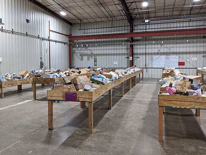 Treasure hunters' paradise! These unassuming wooden bins hold everything from kitchen gadgets to electronics, all waiting to be discovered by savvy shoppers with a keen eye.