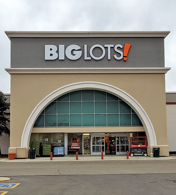 The iconic Big Lots storefront in Kettering beckons with its distinctive arched entrance—like a cathedral dedicated to the religion of savings.