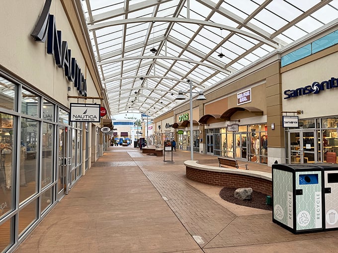 The covered walkways at Tanger Outlets National Harbor offer climate-controlled bargain hunting—like shopping in a greenhouse where the only things growing are your savings.