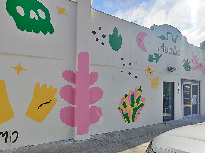 The colorful exterior mural feels like a fashion fever dream – pink cacti and cosmic symbols inviting style explorers to discover treasures within.