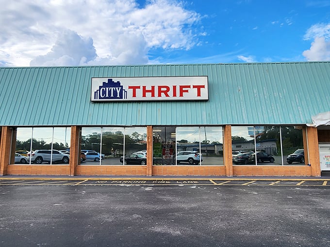 The mint-green roof of City Thrift stands out like a beacon for bargain hunters on Edgewater Drive, promising treasures within its unassuming exterior.