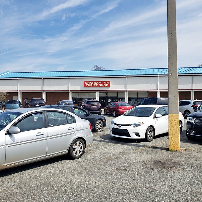The bustling parking lot tells you everything—this isn't just a thrift store, it's a community destination where treasures await behind that iconic blue-roofed storefront.