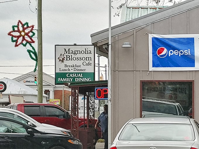 The unassuming exterior of Magnolia Blossom Café proves once again that culinary treasures often hide in plain sight. That neon "OPEN" sign might as well say "PARADISE FOUND."