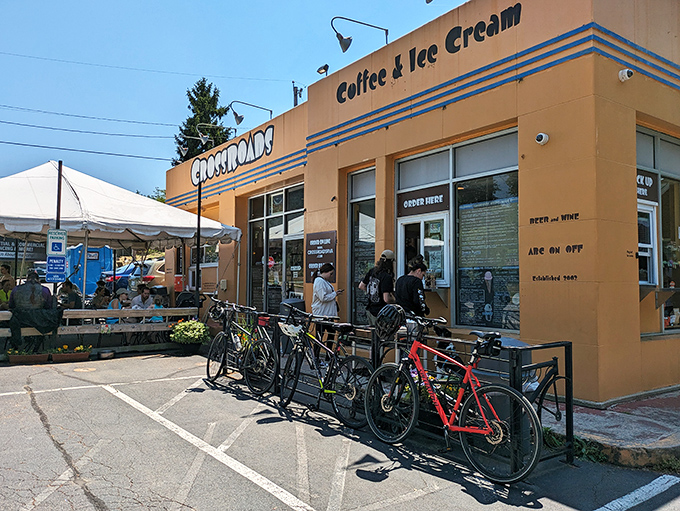 The mustard-yellow exterior of Crossroads stands like a beacon of hope for caffeine-seekers, with bicycles lined up outside like patient steel horses waiting for their riders.