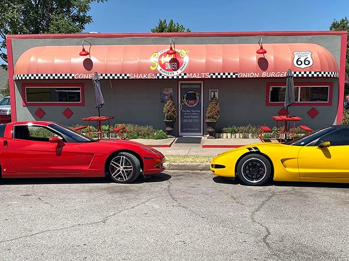 Classic cars parked outside Sid's Diner – where the vehicles are shiny, but the onion burgers are the real showstoppers.