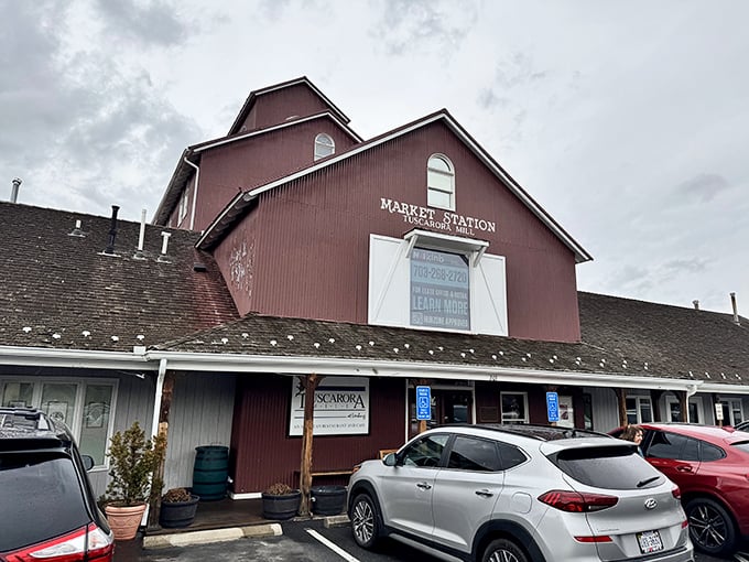 The iconic red exterior of Market Station houses Tuscarora Mill, where culinary magic happens inside this beautifully preserved historic grain mill.
