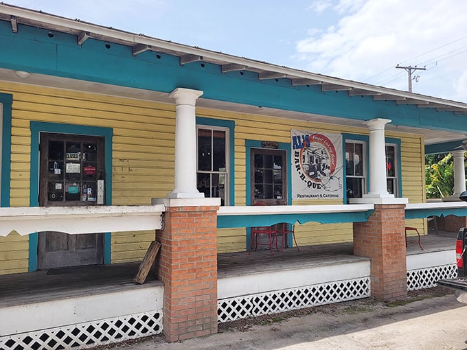 The cheerful yellow exterior with turquoise trim isn't just eye-catching—it's a beacon calling hungry souls to barbecue salvation in Ybor City.