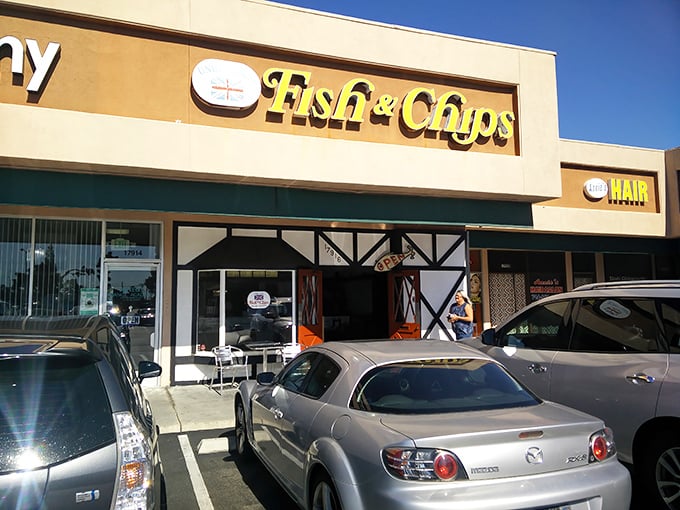 The humble exterior belies culinary treasures within. Tudor-style accents and that bright yellow sign promise authentic British fare in suburban Fountain Valley.