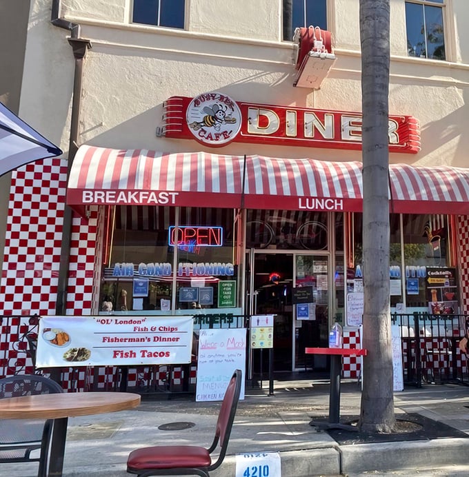 Classic Americana beckons with that iconic red and white awning. The checkerboard pattern practically whispers, "Good food happens here!"